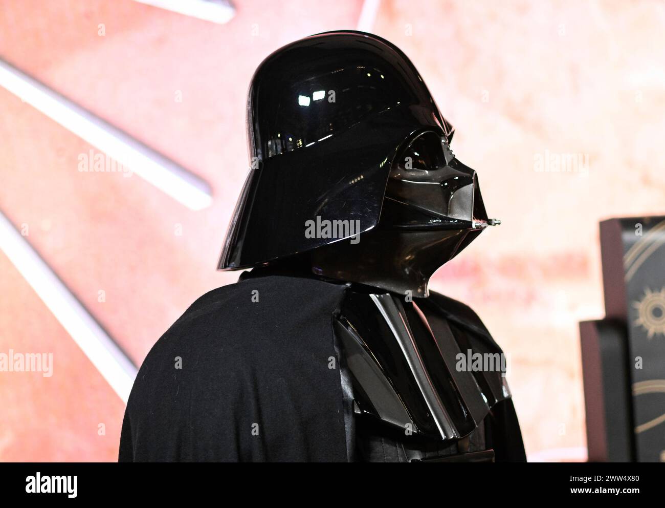 A Darth Vader costumed character participates in the Star Wars themed ...