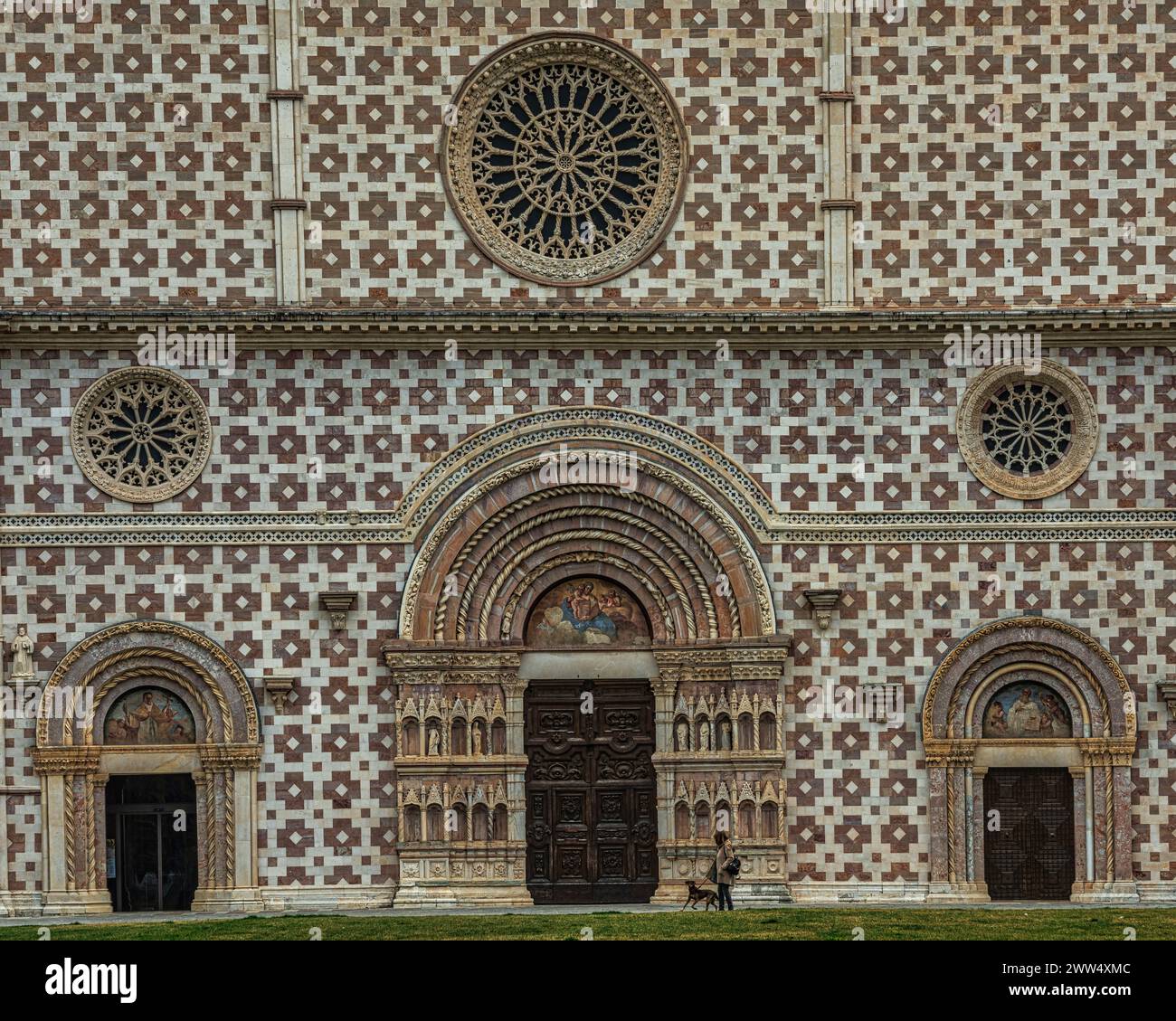View of the three portals and the three rose windows on the Gothic and ...