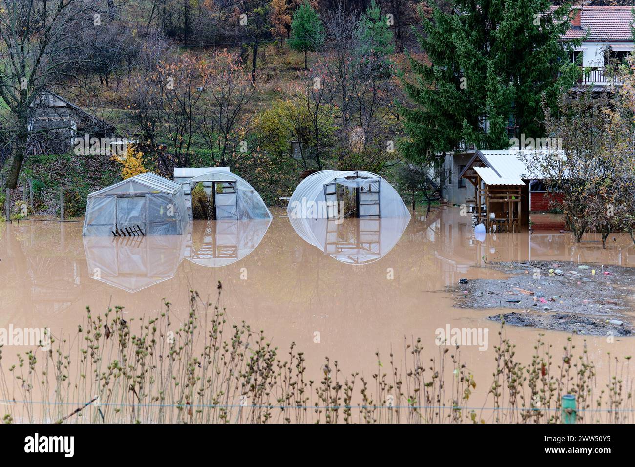 Torrential rain causes flash floods in residential areas. House ...
