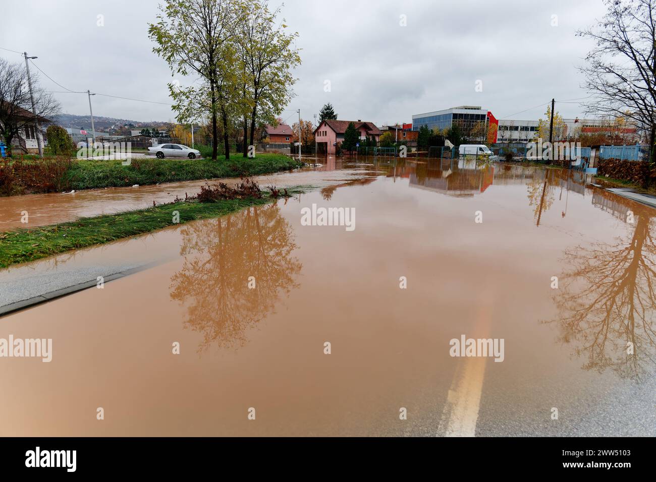 Torrential rain causes flash floods in the city area. Buildings ...