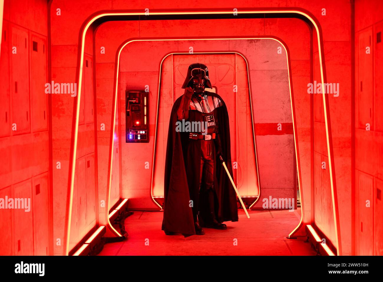 A Darth Vader costumed character poses at the Hasbro and Amazon Star ...