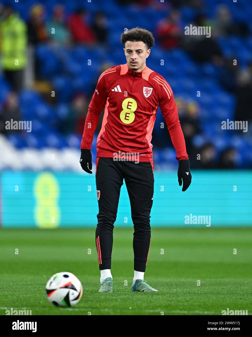 Cardiff, UK. 21st Mar, 2024. Ethan Ampadu of Wales warms up ahead of ...
