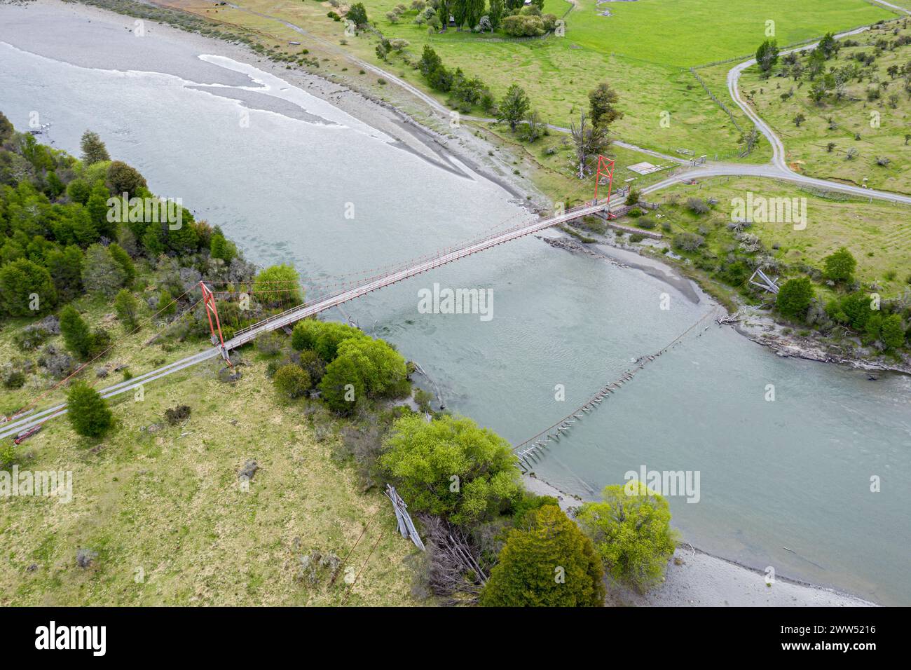 Old-style suspension bridge over river Rio Nadis south of Cochrane ...