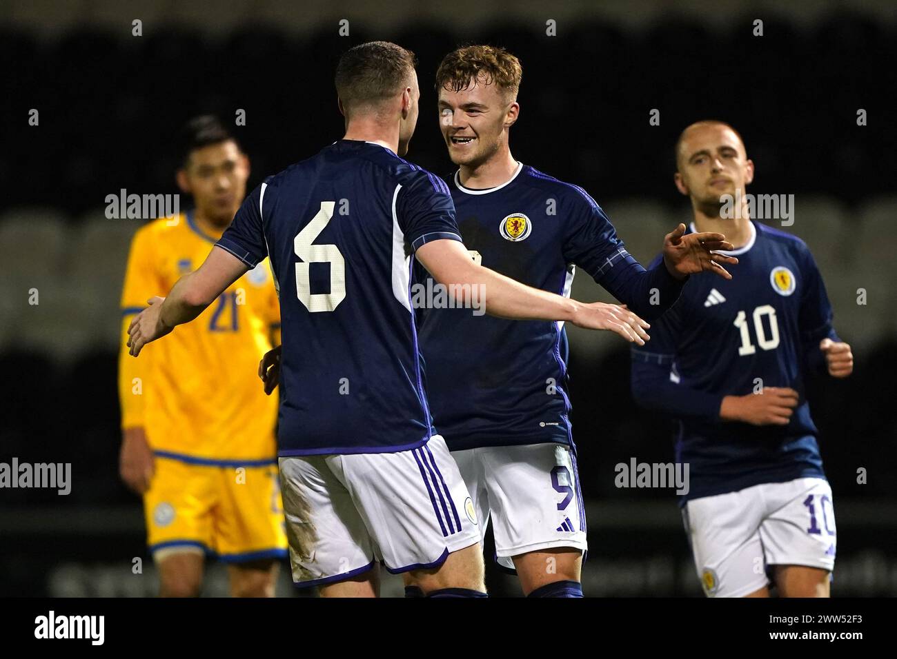 Scotland's Tommy Conway (centre) celebrates scoring their side's third ...