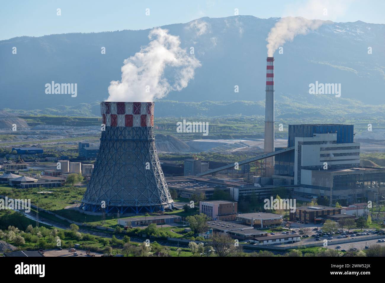 Thermal power station expelling pollutants to the air. City with poor ...