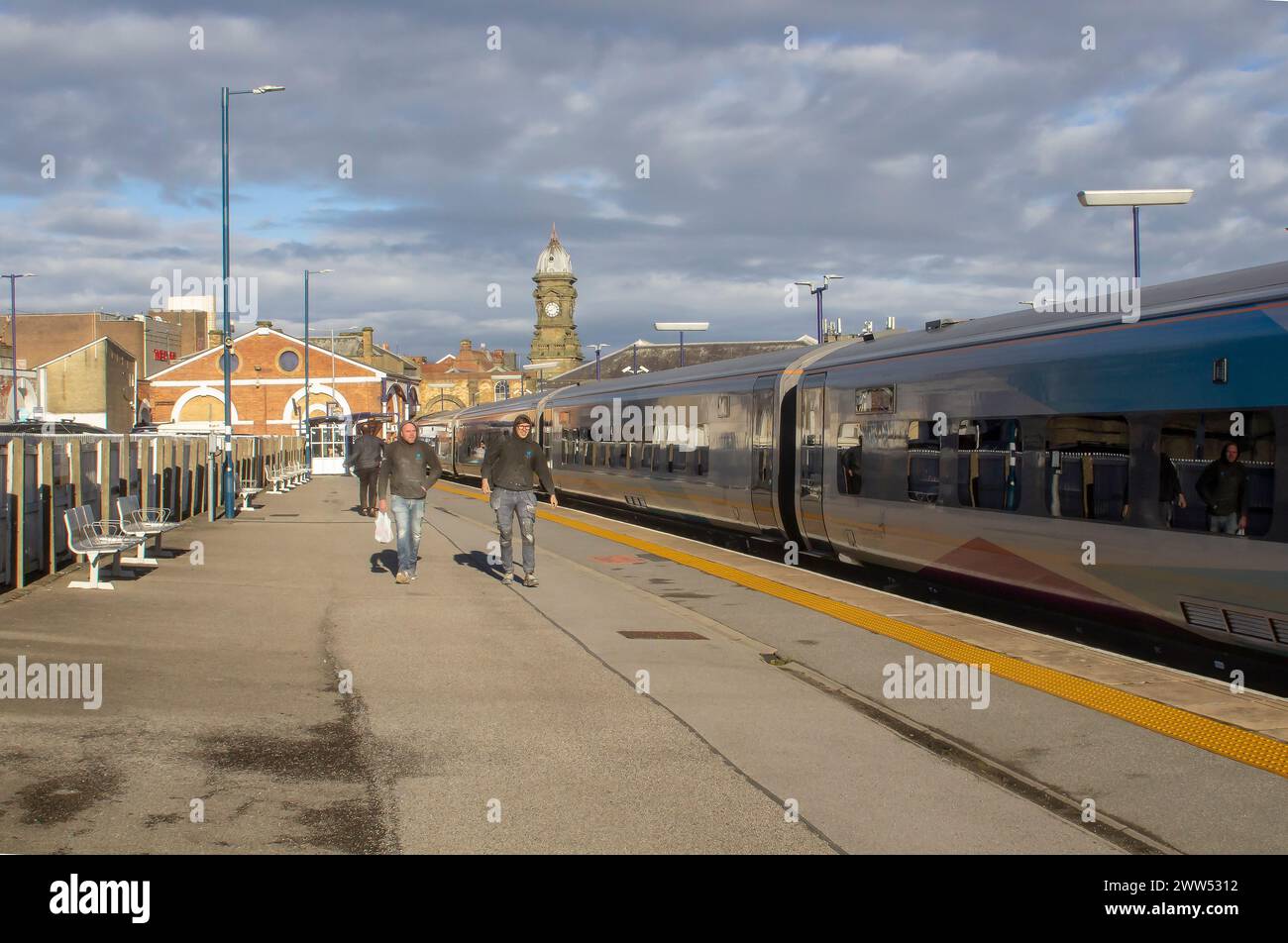 3 November 23 Commuters wa;k the platform in Scarborough Railway ...