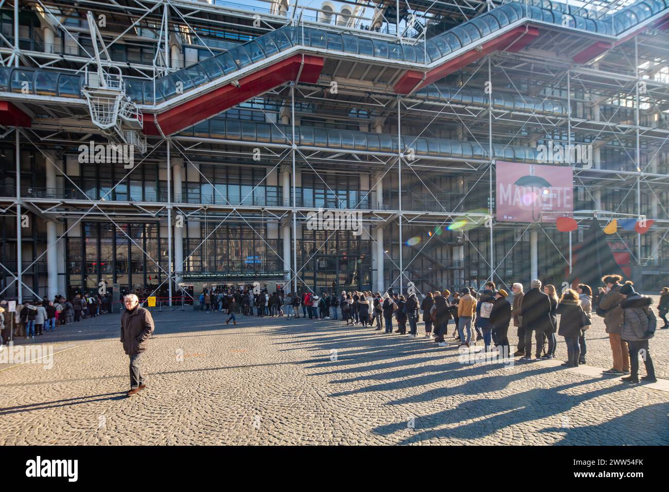 Visitors lined up outside the Pompidou Center for a Magritte art ...