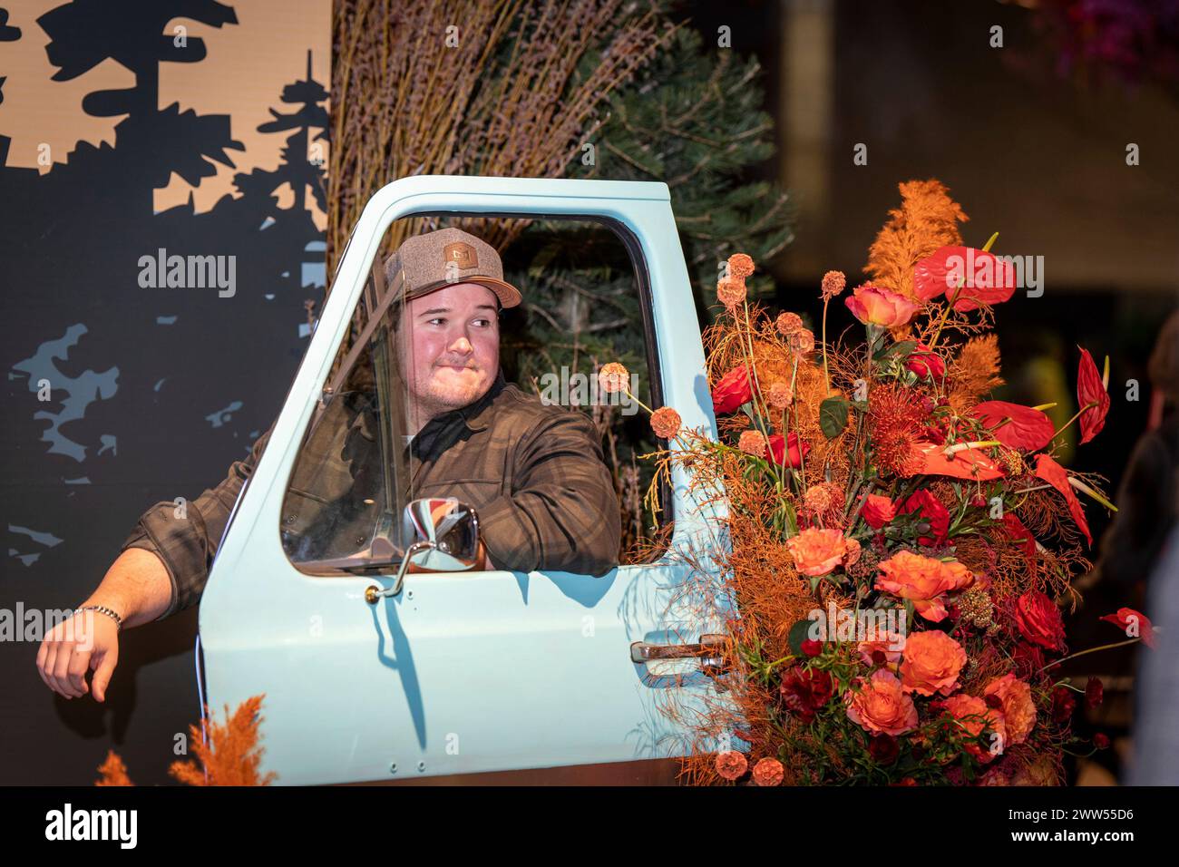 Chris Walek poses for a photo in the exhibit "America in Bloom" by ...
