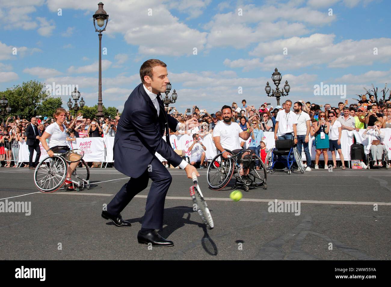 FILE - French President Emmanuel Macron plays tennis on the Pont ...