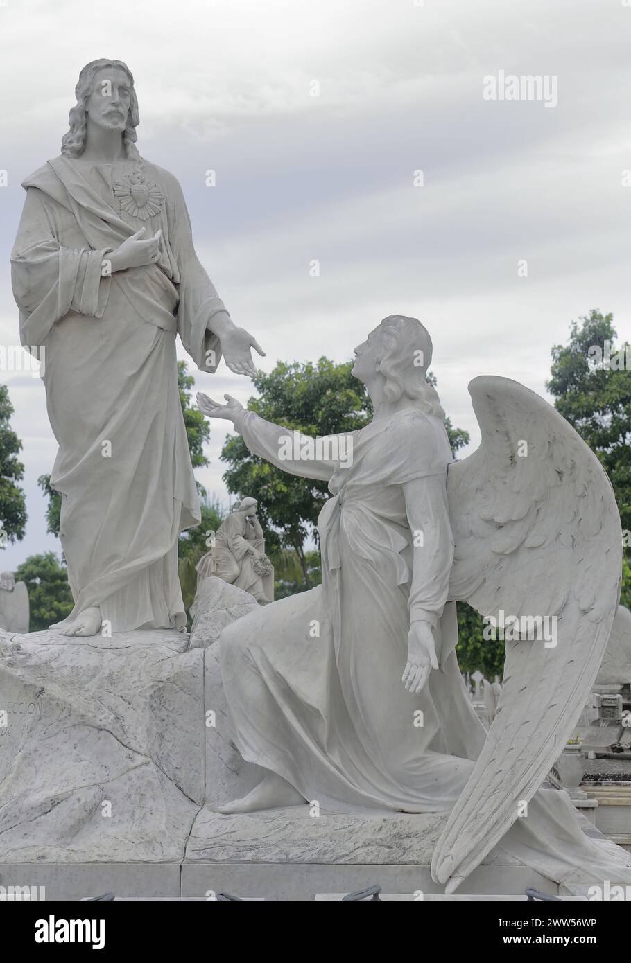093 Marble kneeling angel and Jesus Christ sculpture atop a tomb, Avenida Cristobal Colon Avenue ...