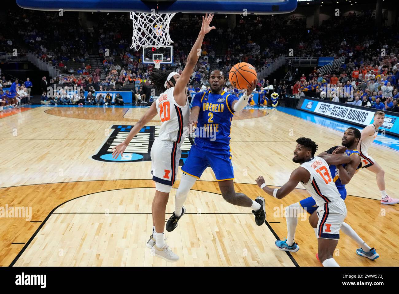Morehead State guard Jordan Lathon (2) shoots around Illinois forward ...
