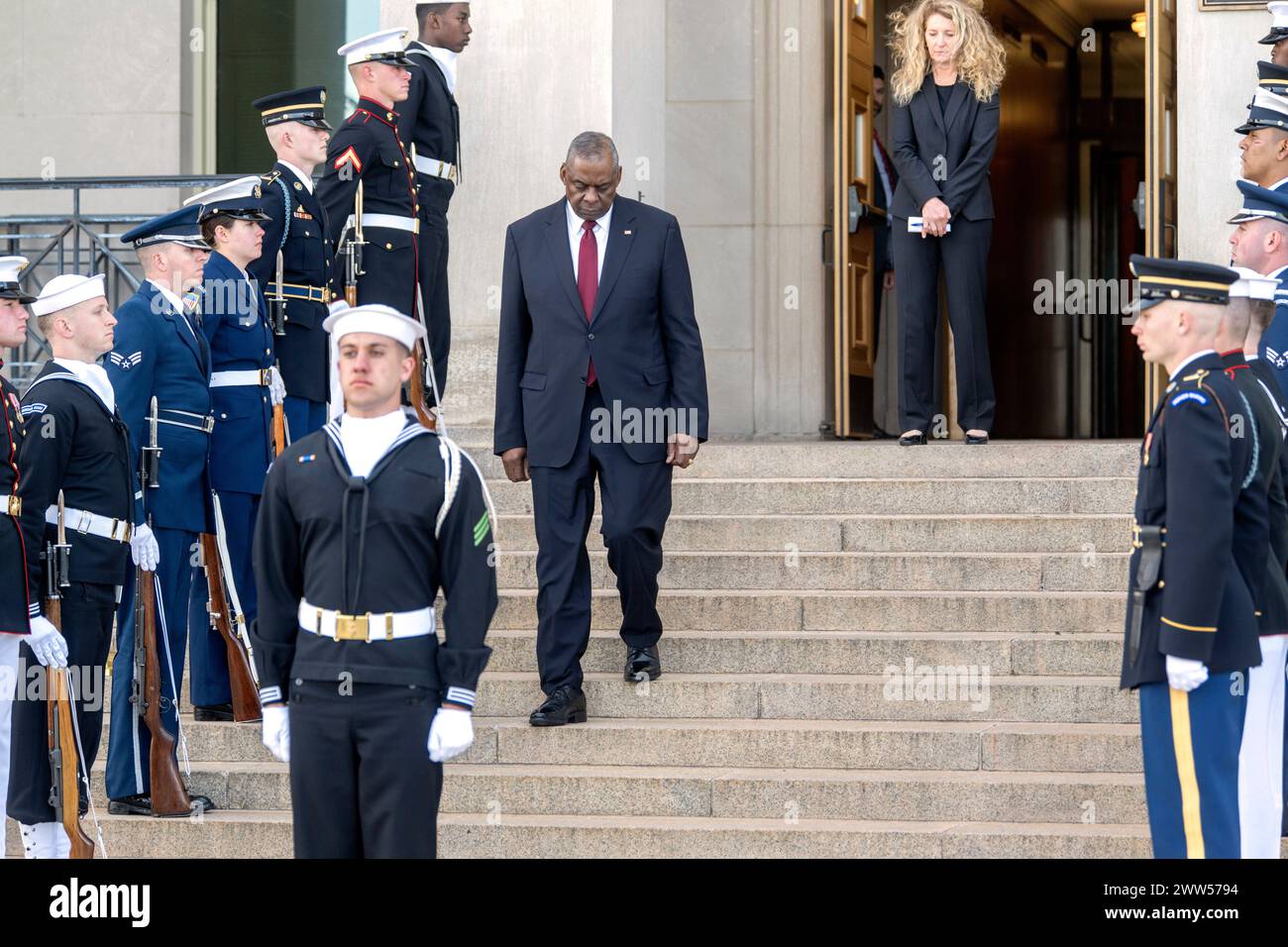 Secretary of Defense Lloyd Austin walks down the steps of the Pentagon ...