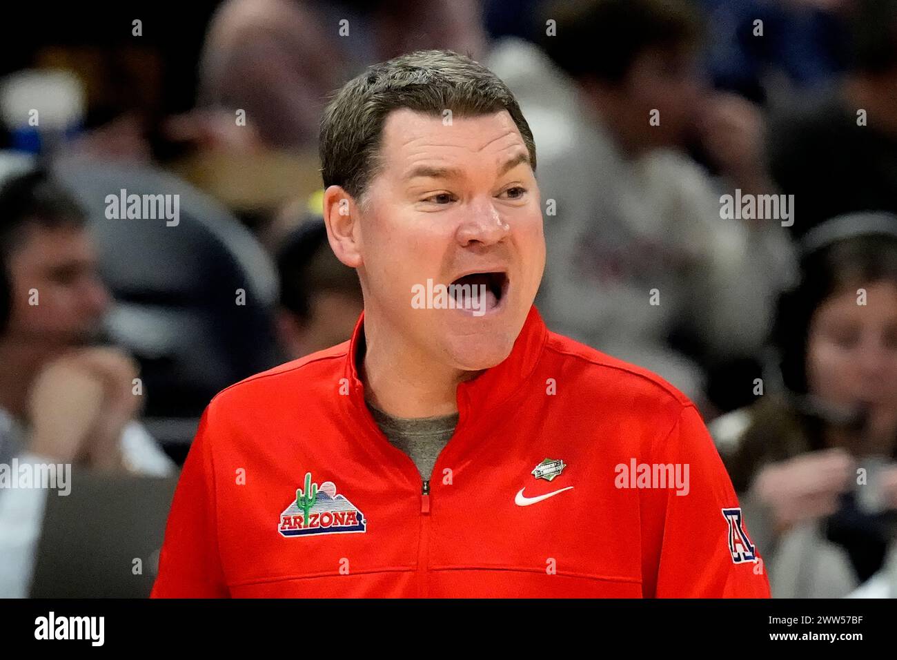 Arizona head coach Tommy Lloyd reacts during the second half of a first ...