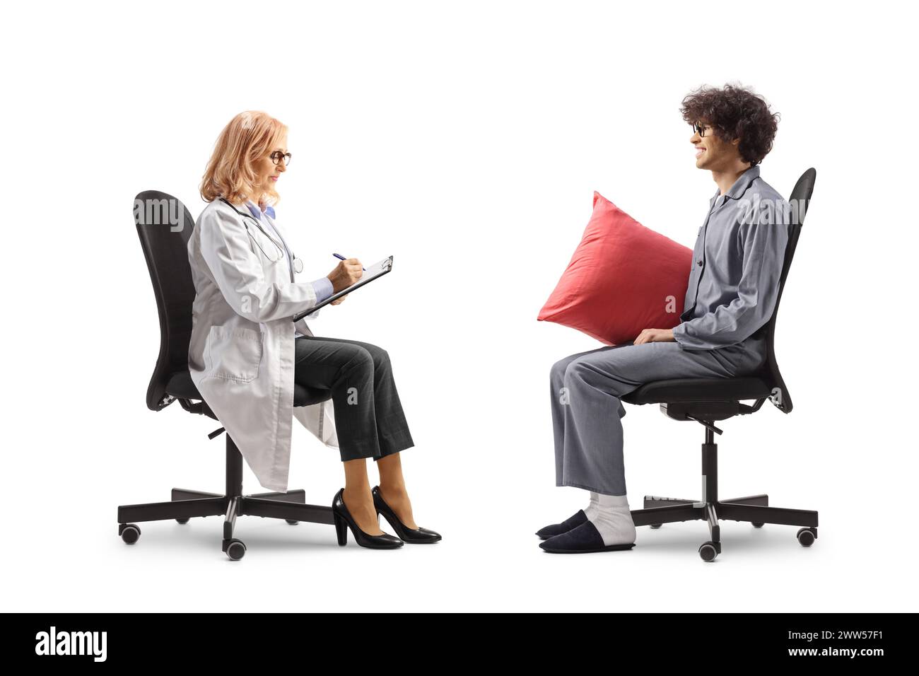 Man in pajamas sitting and talking to a female doctor isolated on white ...