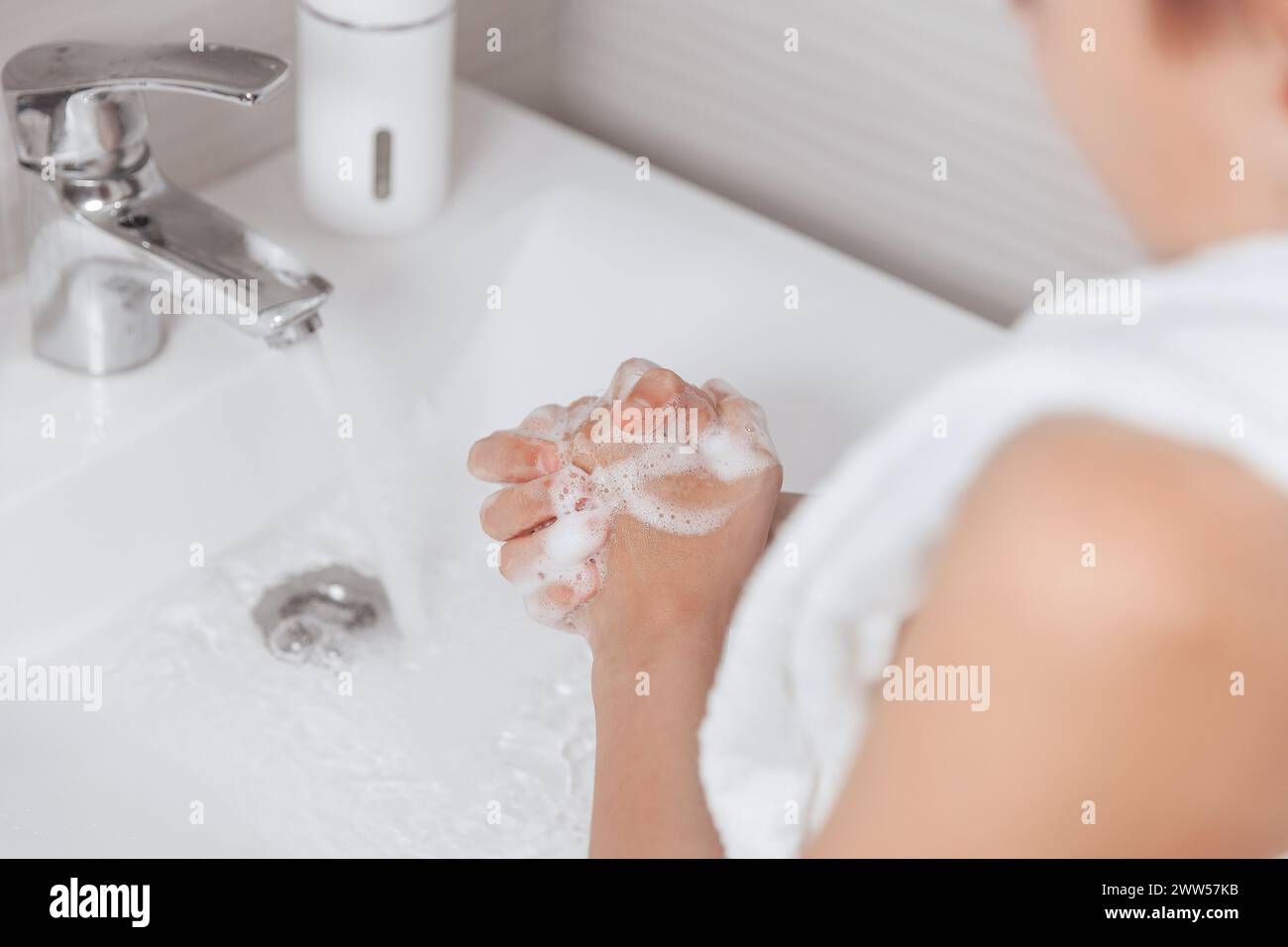Teenage self-care: a refreshing moment in the bathroom Stock Photo - Alamy