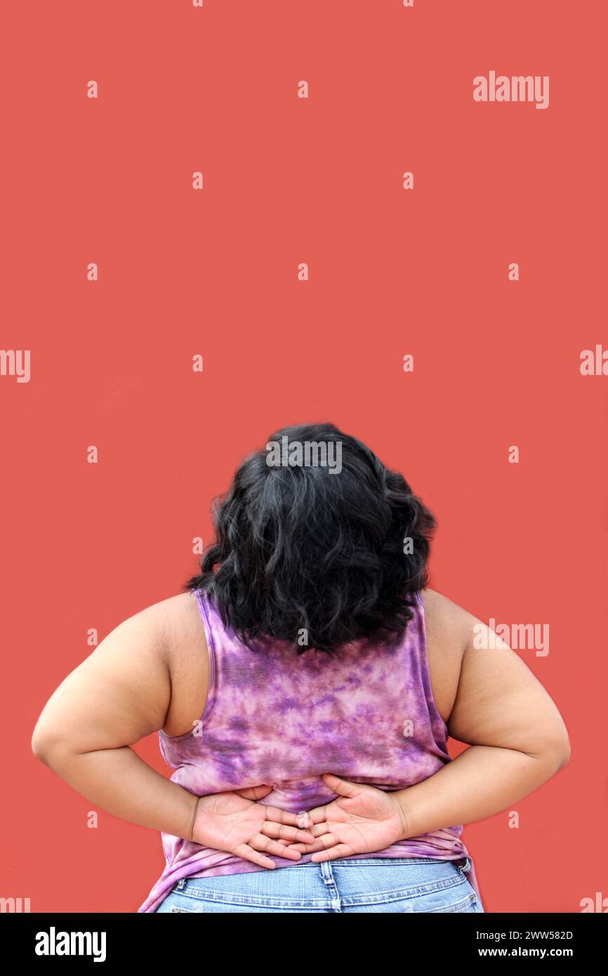 Young 20-year-old woman suffers from back pain due to damage to the ...