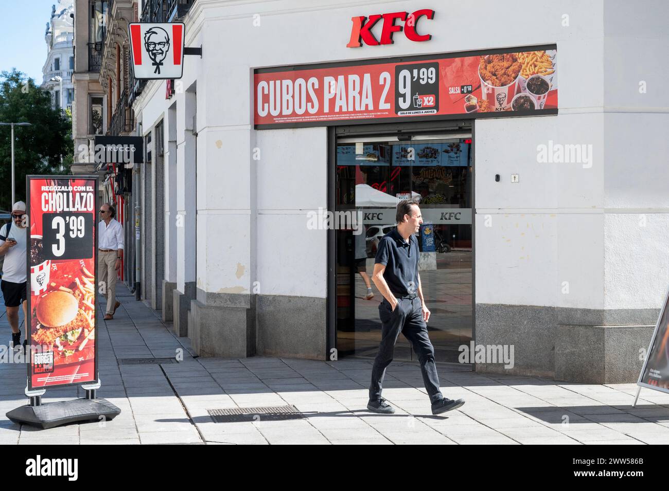 A pedestrian walks past the American fast food chicken restaurant chain ...