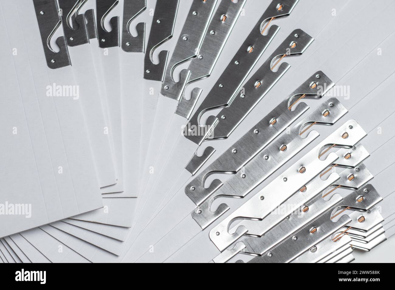 White cardboard folders with metal hangers Stock Photo - Alamy