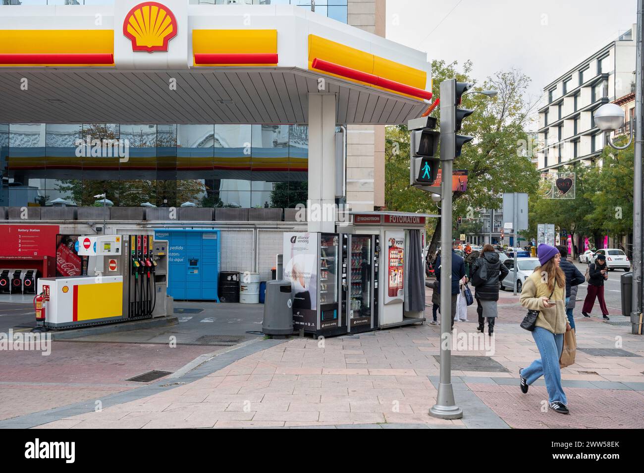 A pedestrian walks past the Global group of energy and petrochemical ...