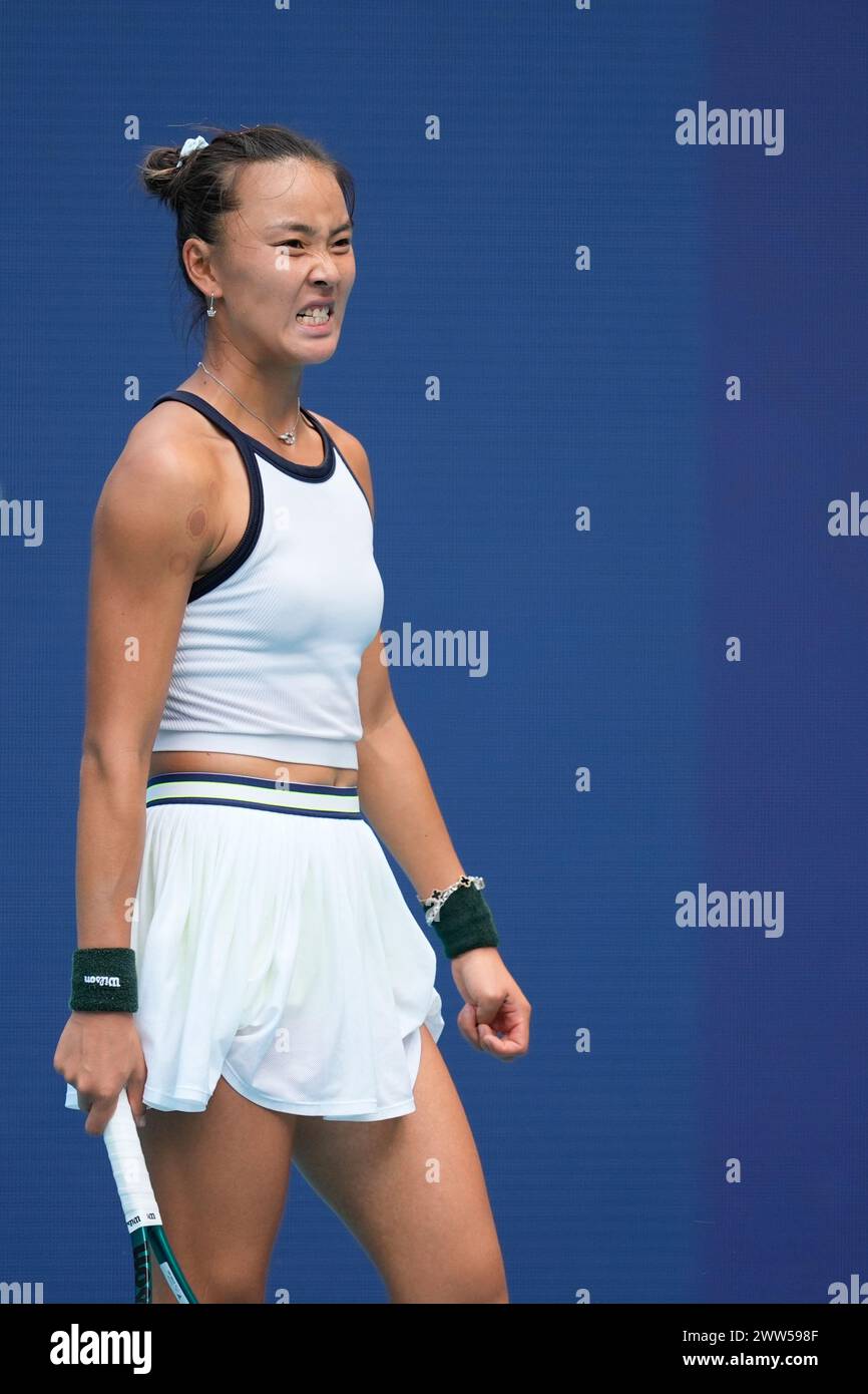 Yue Yuan, of China, reacts after hitting a ball out during her women's ...