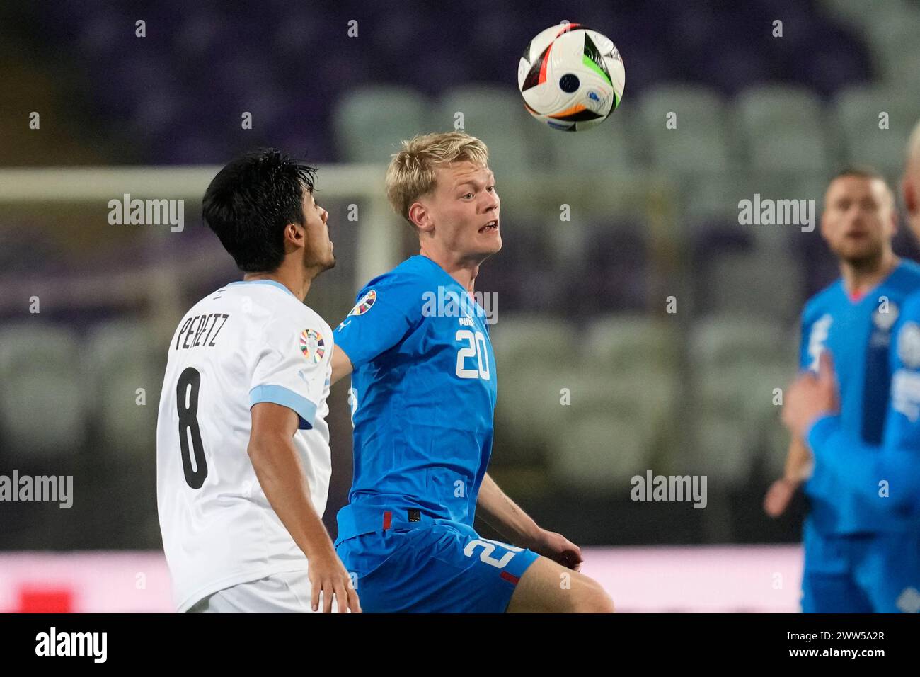 Israel's Dor Peretz, left, challenges for the ball with Iceland's Orri ...