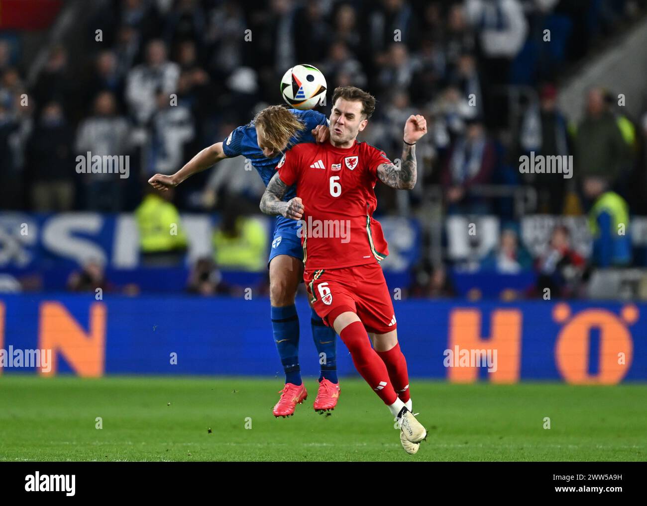 Joel Pohjanpalo of Finland and Joe Rodon of Wales battle for the ball ...