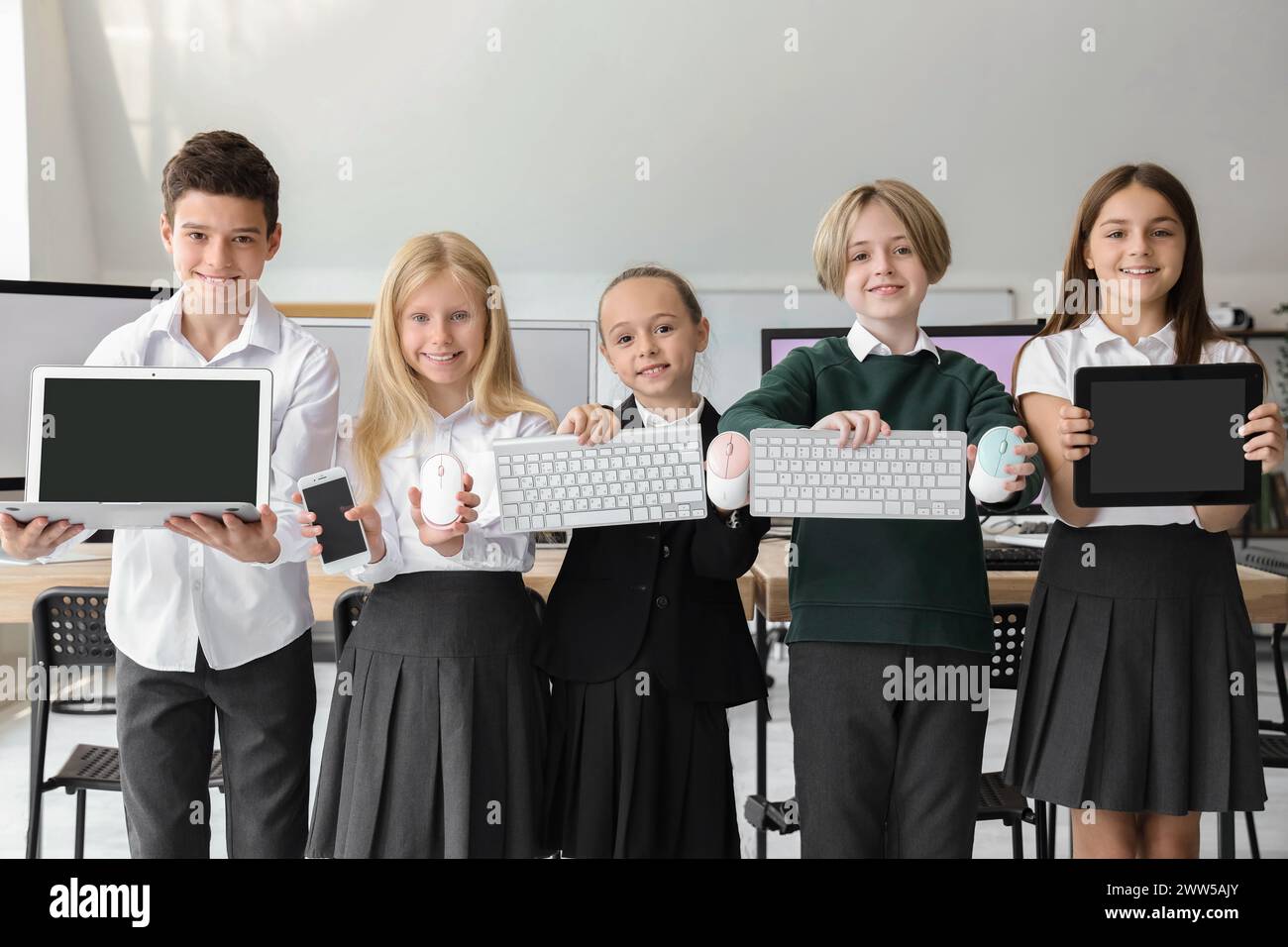 Little children with modern devices at school computer lab Stock Photo ...