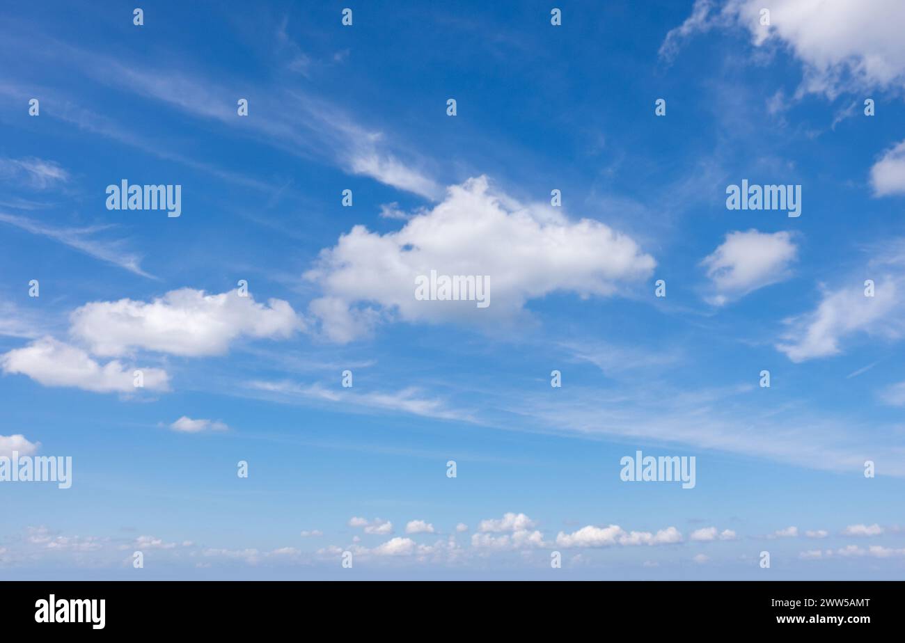 Blue sky filled with clouds, creating expansive view Stock Photo - Alamy