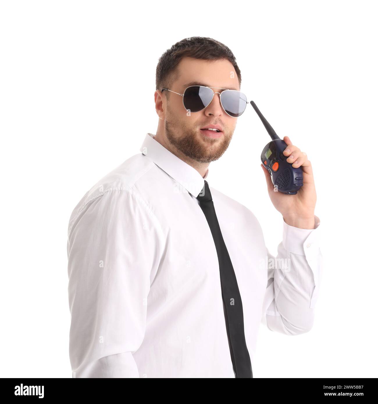 Male police officer with radio transmitter on white background Stock ...