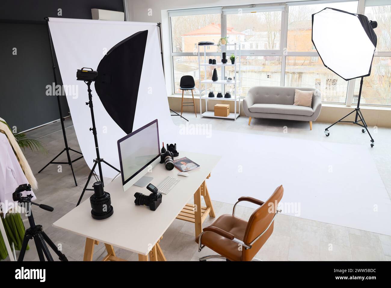Interior of modern studio with photographer's workplace and ...