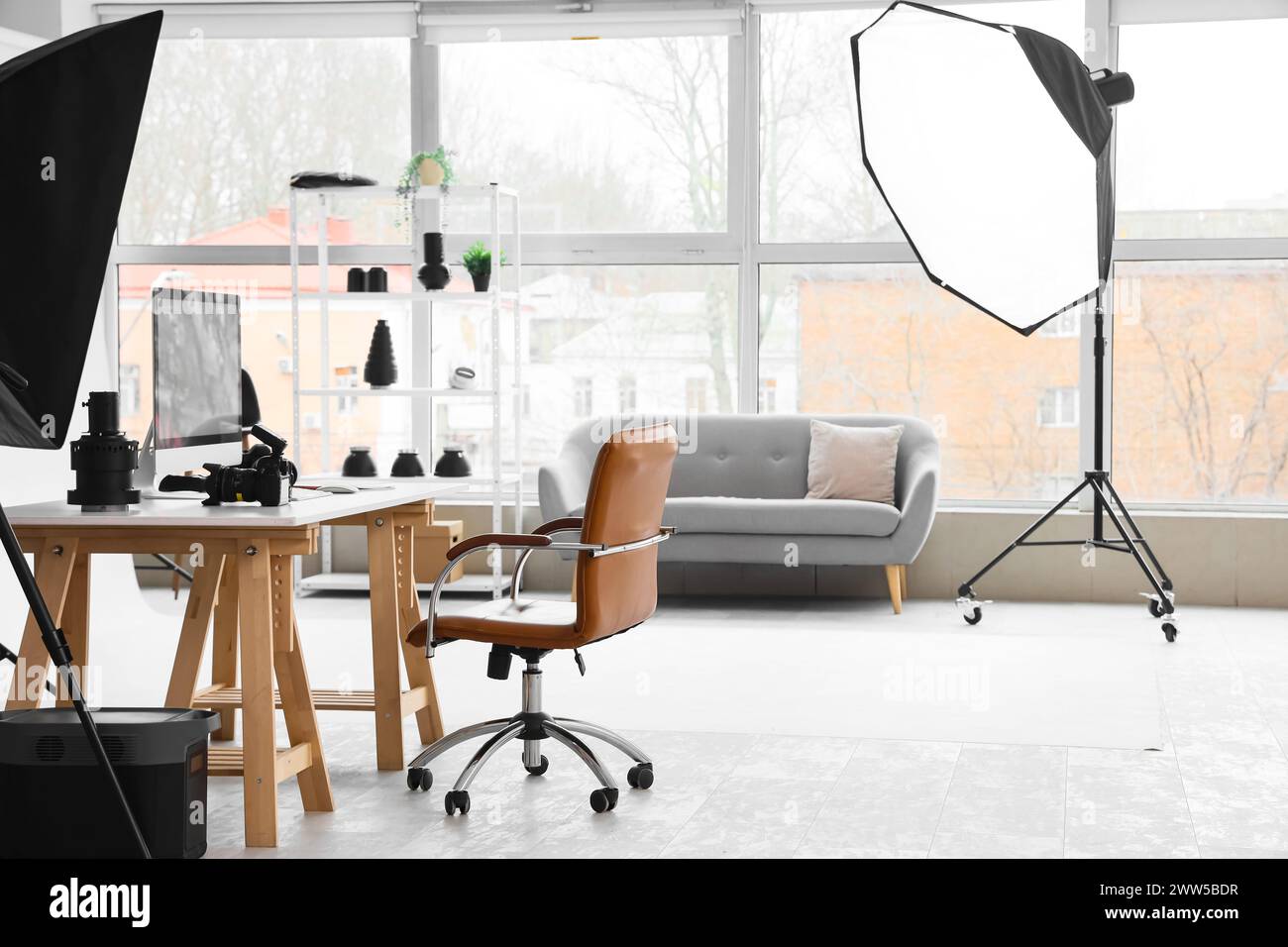 Interior of modern studio with photographer's workplace and ...