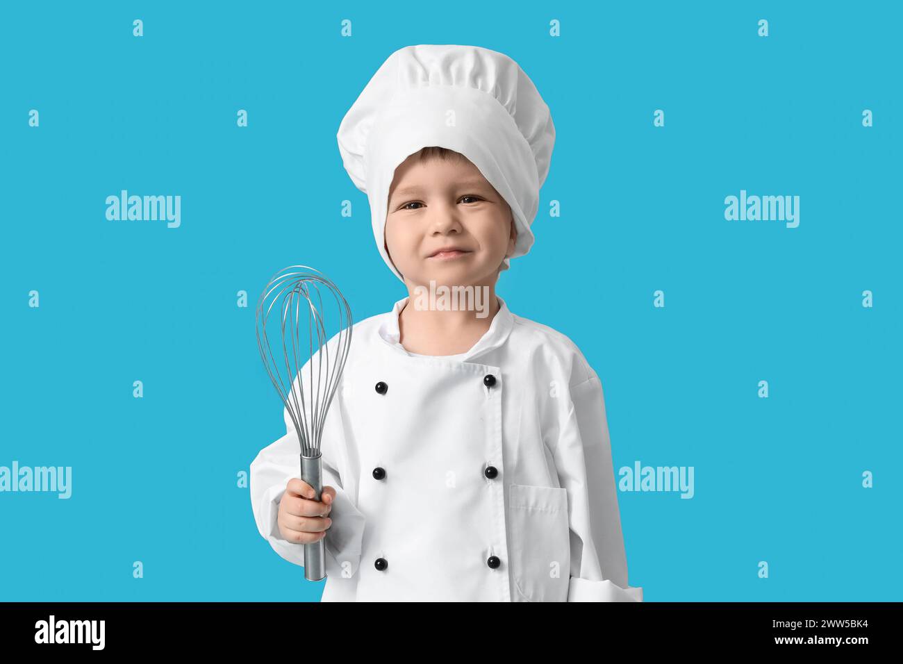 Cute little chef with whisk on blue background Stock Photo - Alamy