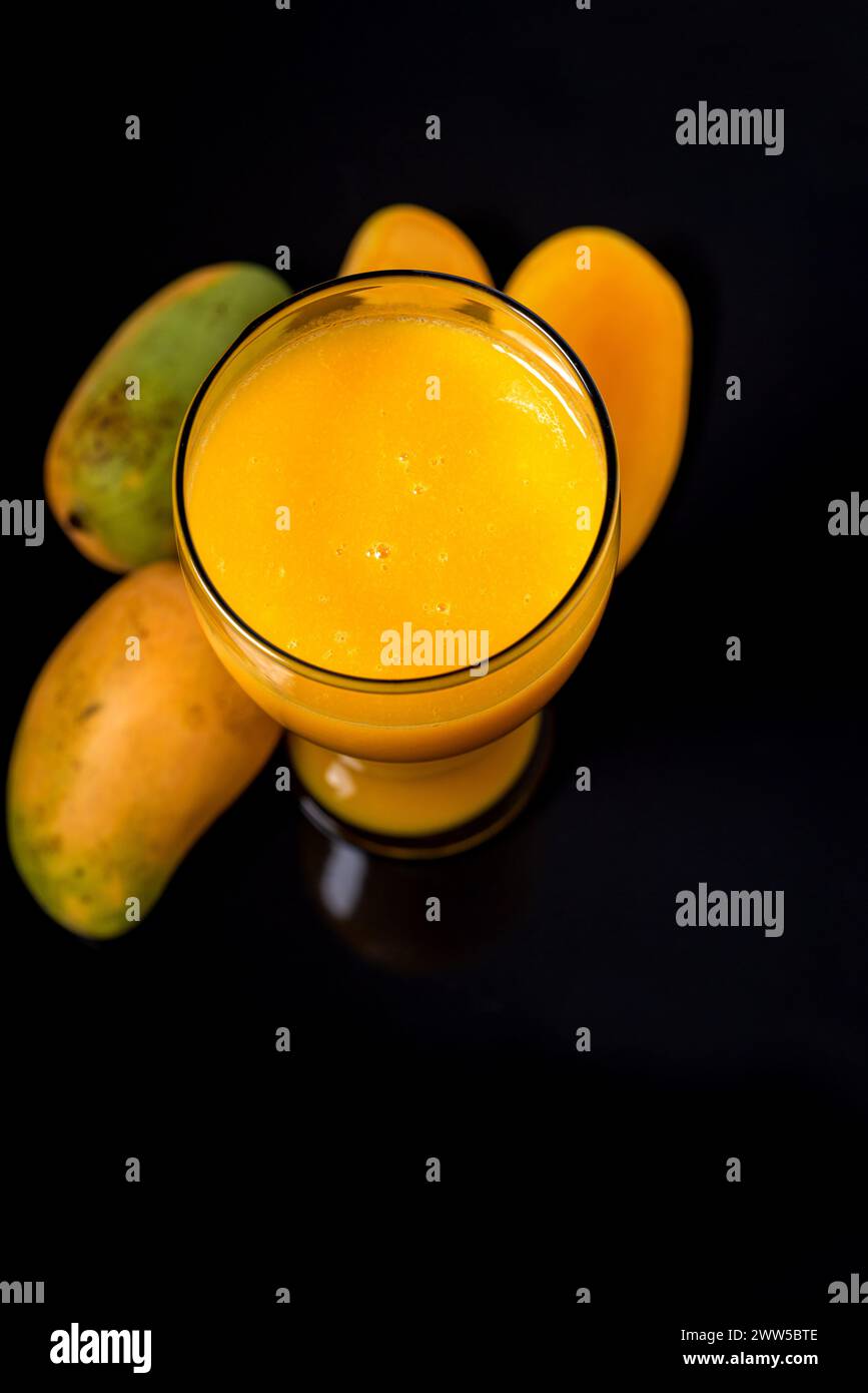 Splash of juice and sweet tropical fruits mango hi-res stock ...