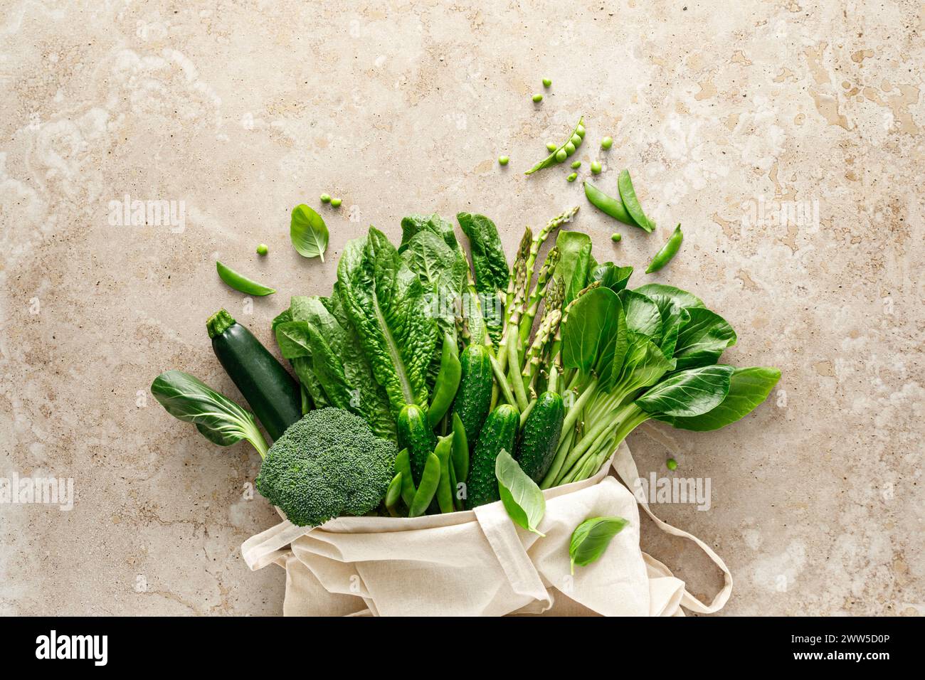 Green vegetable background. Various green vegetables in a shopping bag ...