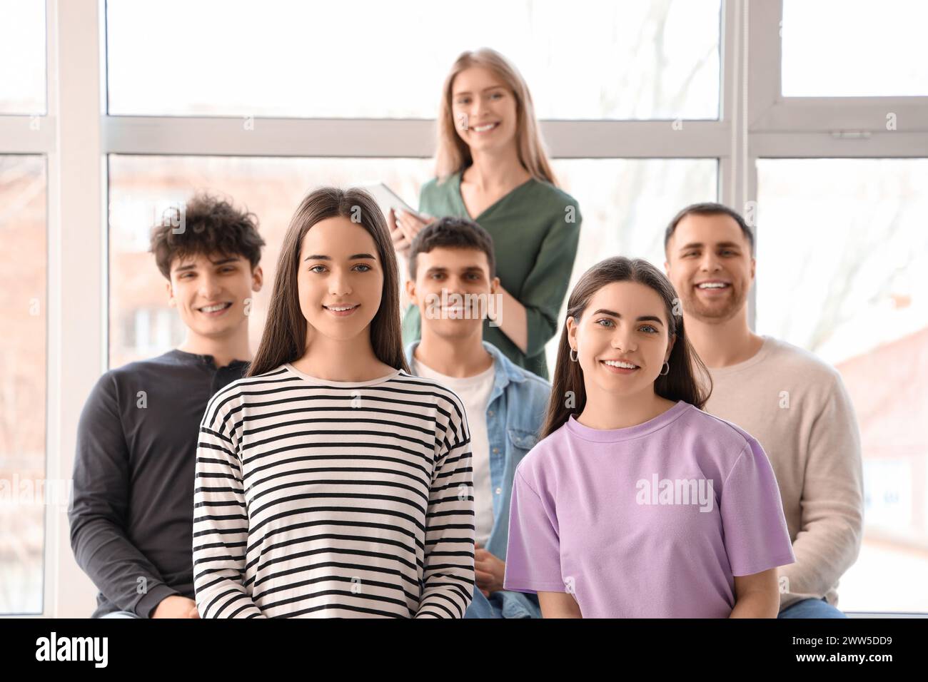 Young people with psychologist at group therapy session Stock Photo - Alamy