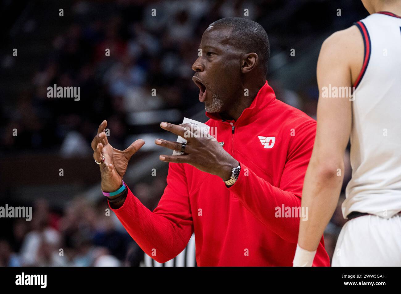 Dayton head coach Anthony Grant talks with his players during the first ...