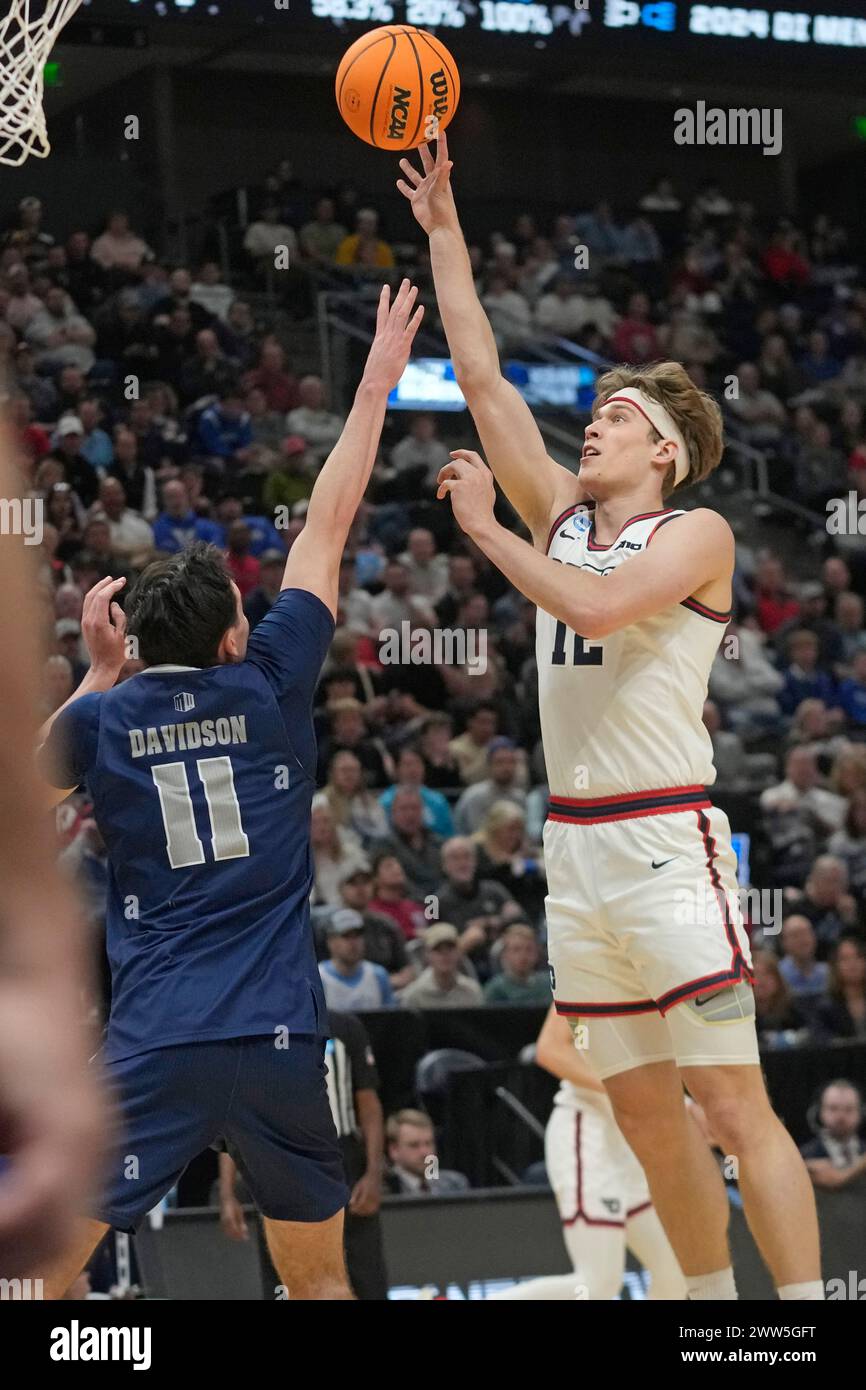 Dayton forward Petras Padegimas (12) shoots as Nevada forward Nick ...