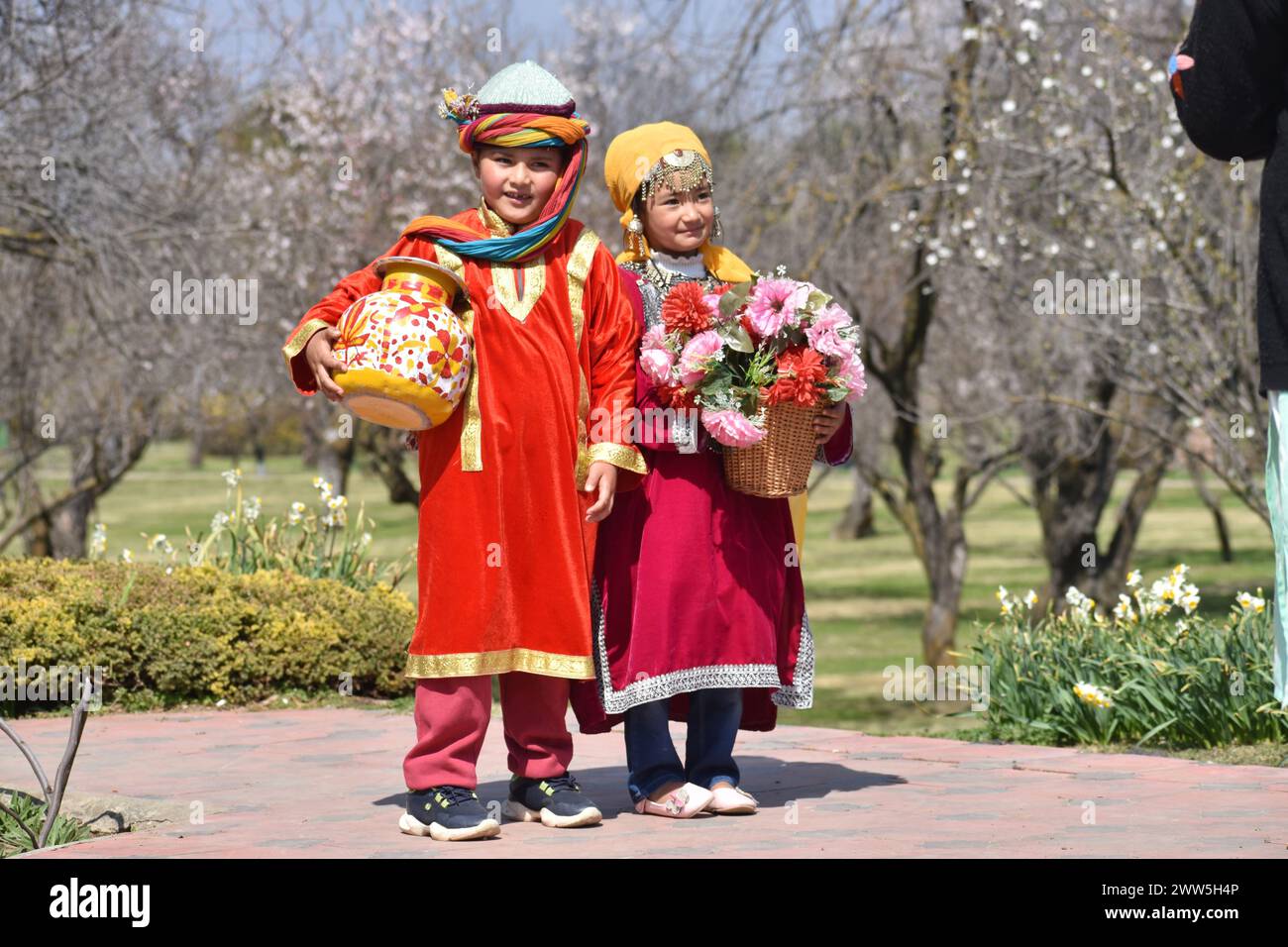 Srinagar, India. 20th Mar, 2024. March 20, 2024, Srinagar India: Two children are seen across ...
