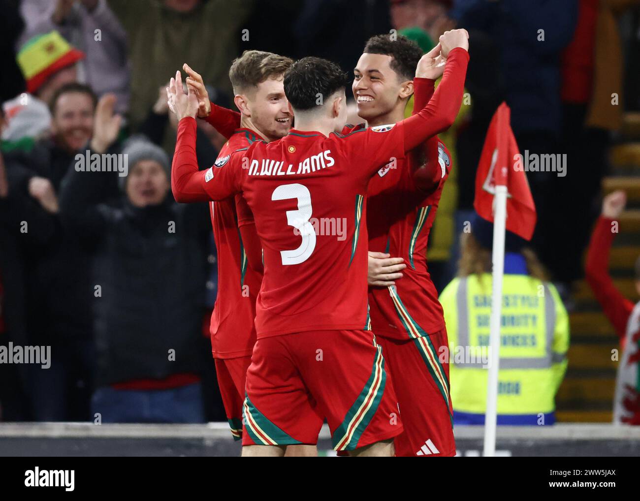 Cardiff, UK. 21st Mar, 2024. Brennan Johnson of Wales (r) celebrates ...