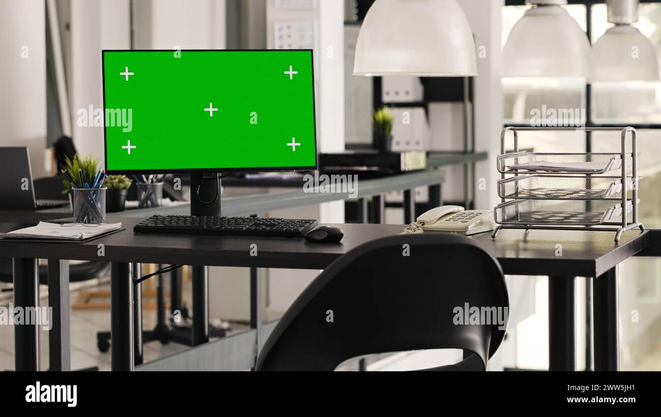 Greenscreen display placed on office desk used for business operations ...