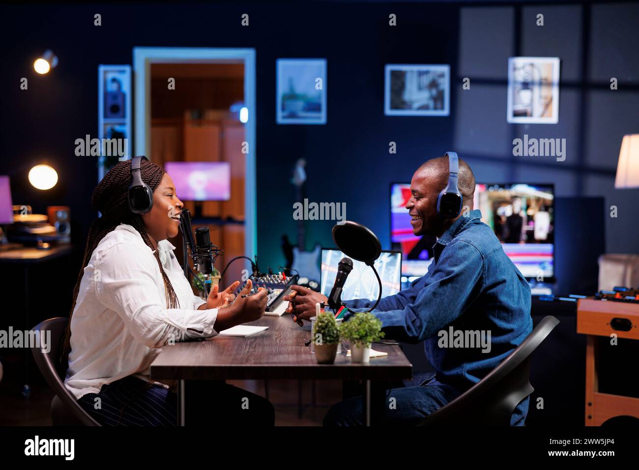 Cheerful african american couple having a conversation at home, and ...