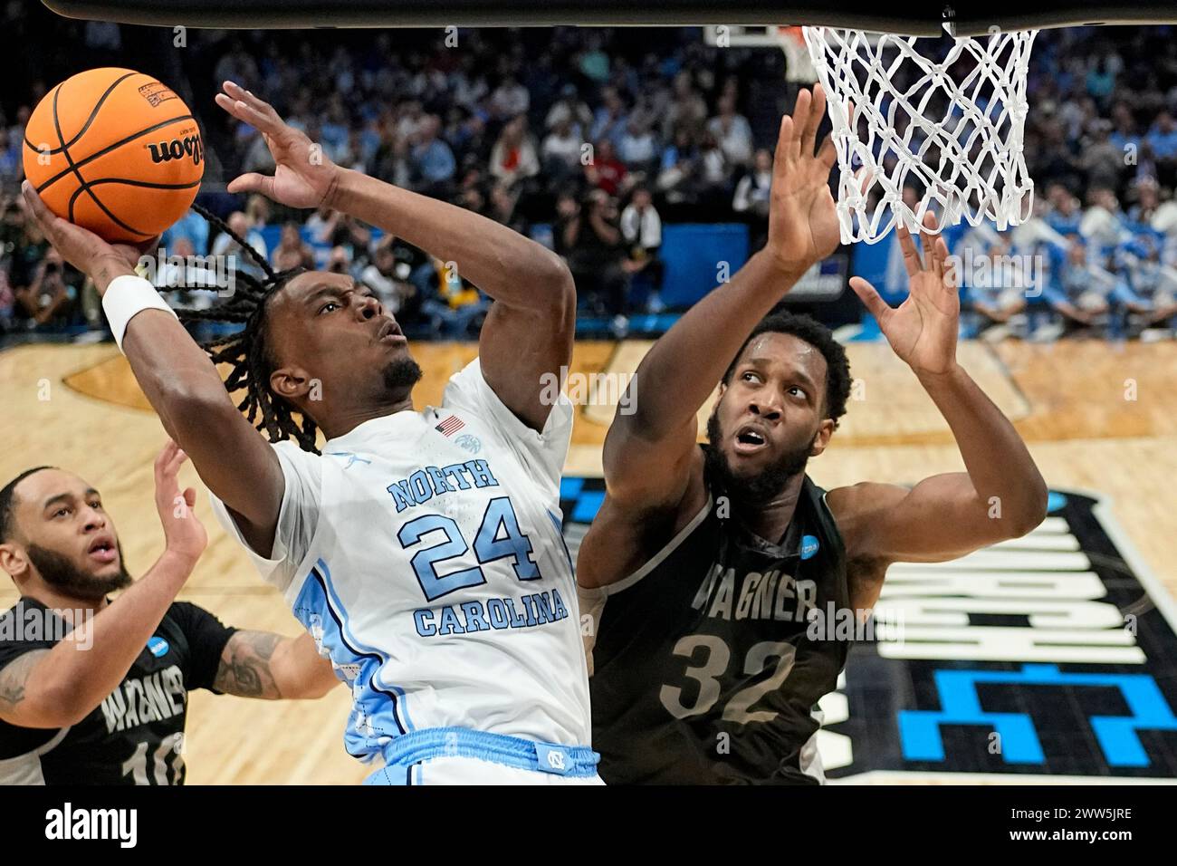 North Carolina forward Jae'Lyn Withers shoots over Wagner forward ...