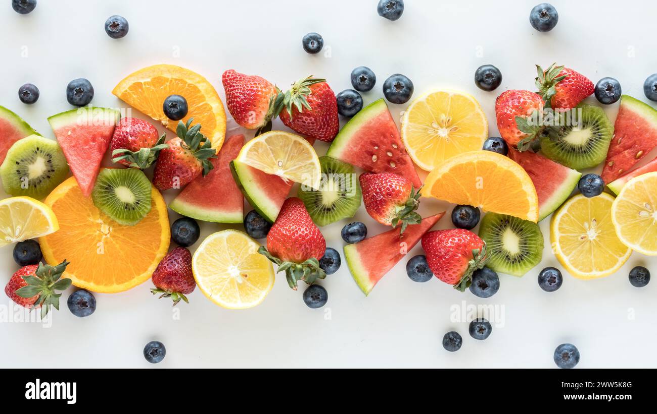 A top down view of a narrow line of various pieces of fruit Stock Photo ...