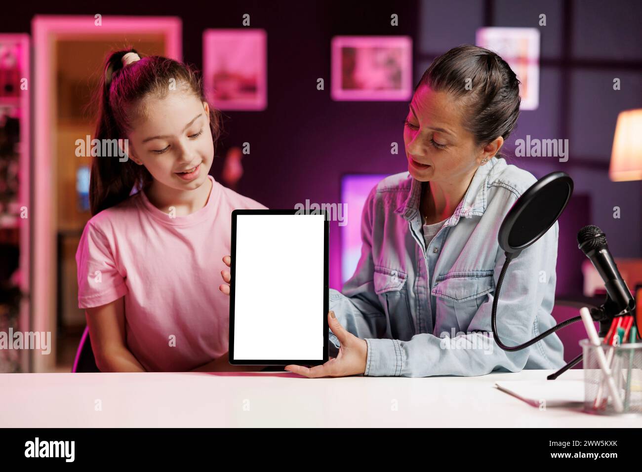 Daughter and parent filming content about best mockup tablets on the ...