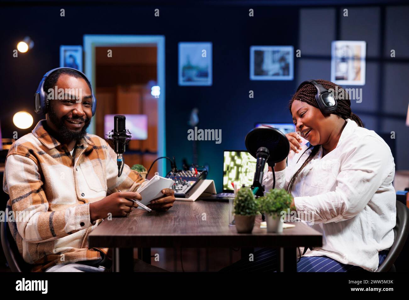 Interviewer recording entertaining discussion with comedian during ...