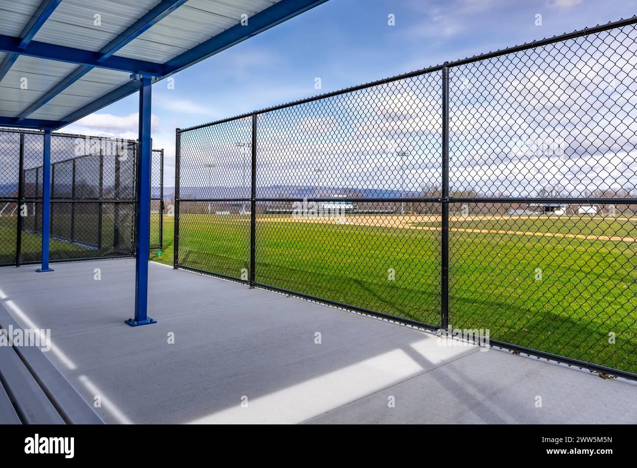 View of typical nondescript high school baseball softball dugout with ...