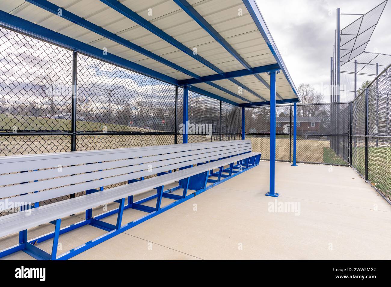 View of typical nondescript high school baseball softball dugout with ...