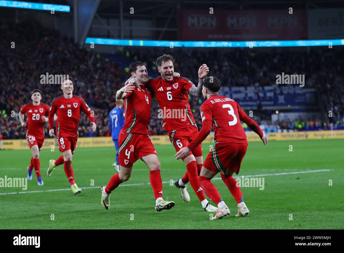 Ben Davies, Neco Williams (3) and Joe Rodon (6) of Wales celebrate ...