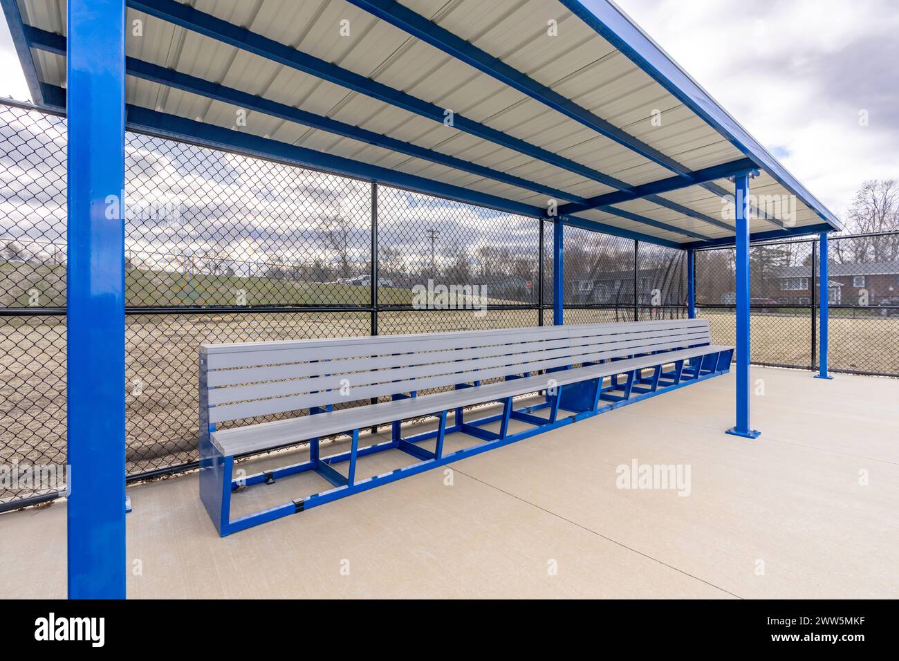 View of typical nondescript high school baseball softball dugout with ...