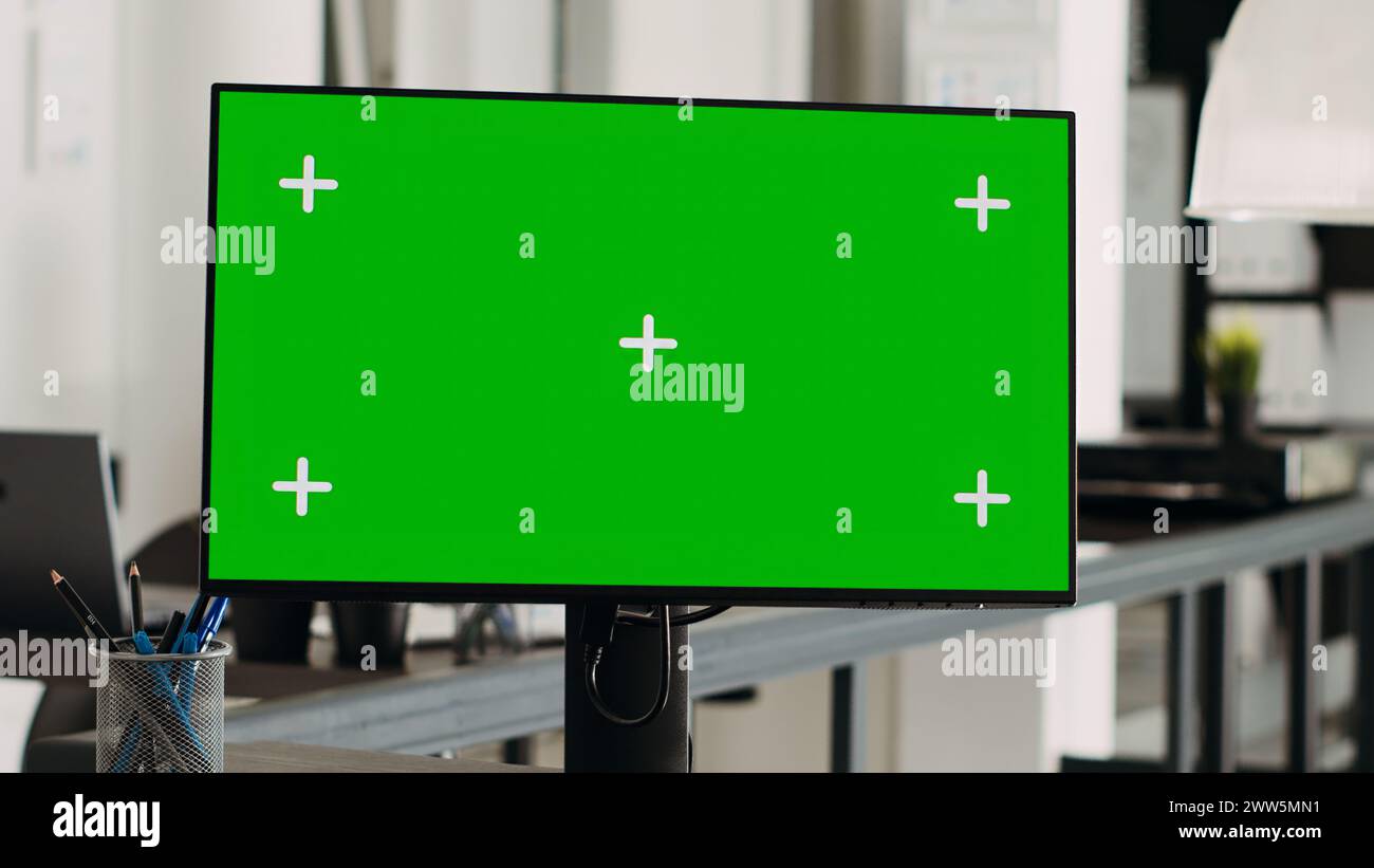 Greenscreen computer display on desktop, empty small business office ...